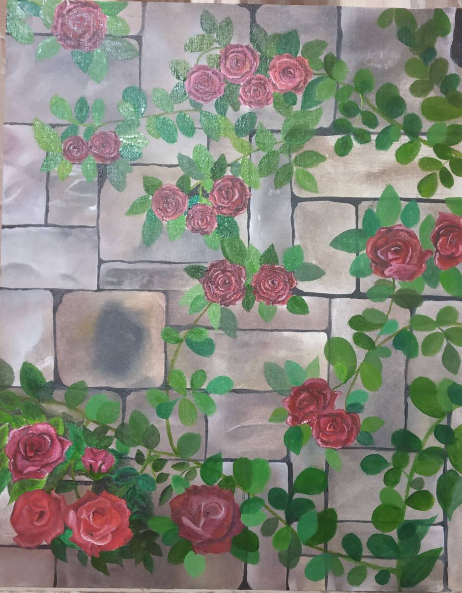 Bush of roses over stone wall
